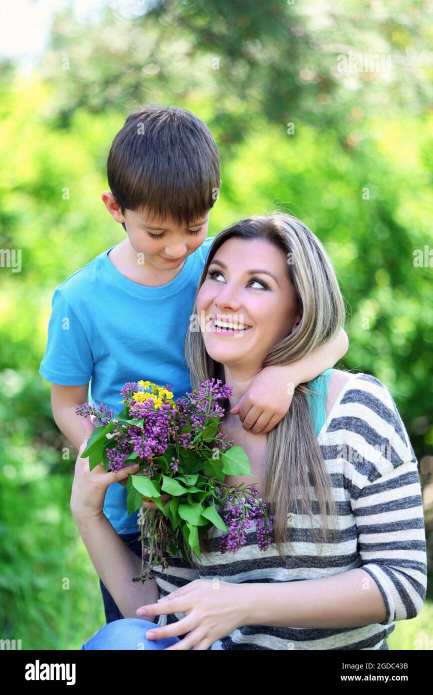 Happy mom and son in the park Stock Photo - Alamy