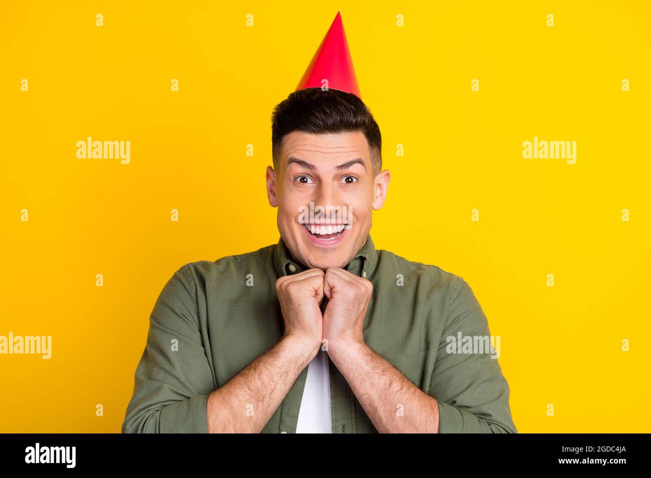 Photo of young guy happy positive smile celebrate birthday party cone ...