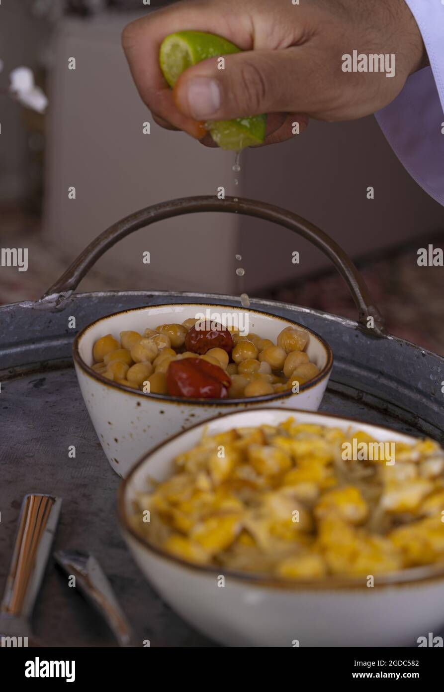 Man eating emirates traditional food at the table Stock Photo - Alamy