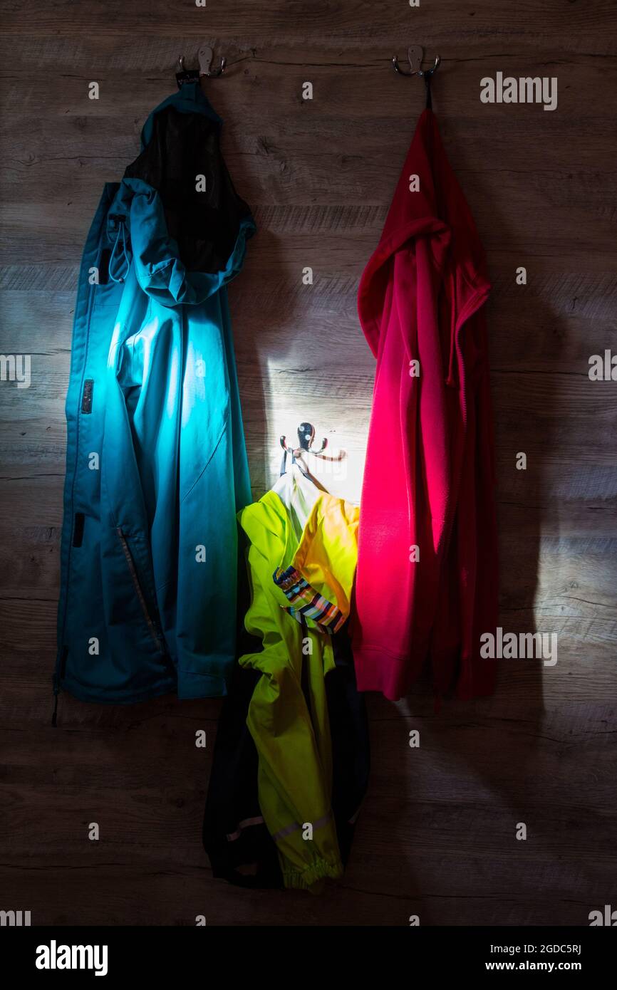 Raincoat hanging hi-res stock photography and images - Alamy
