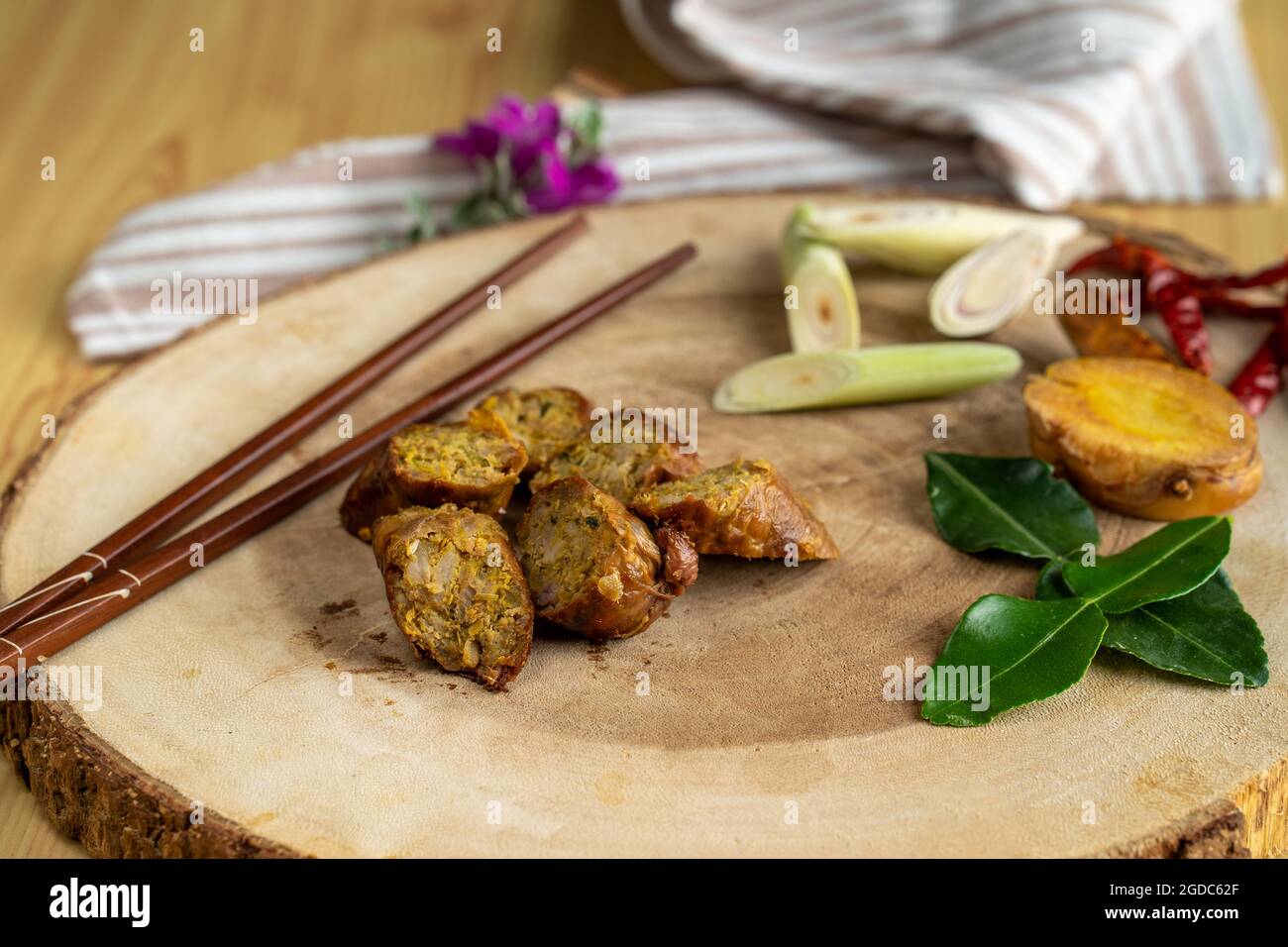 Northern Thai Spicy Sausage and spices on a wooden cutting board Stock ...