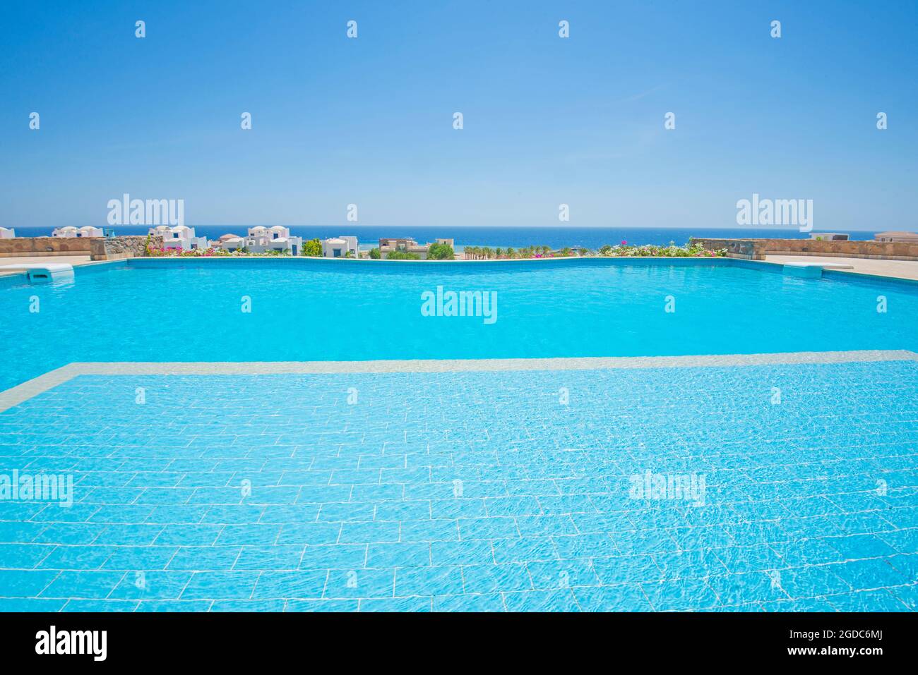 Large outdoor infinity swimming pool at a luxury tropical hotel resort ...
