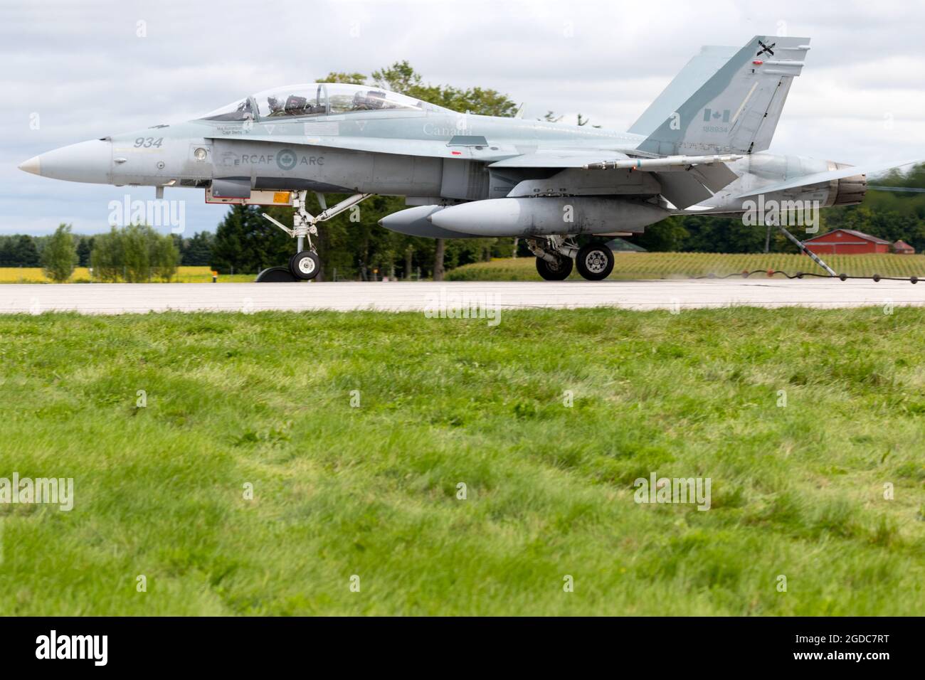A Royal Canadian Air Force (RCAF) CF-18 Hornet landing with the ...