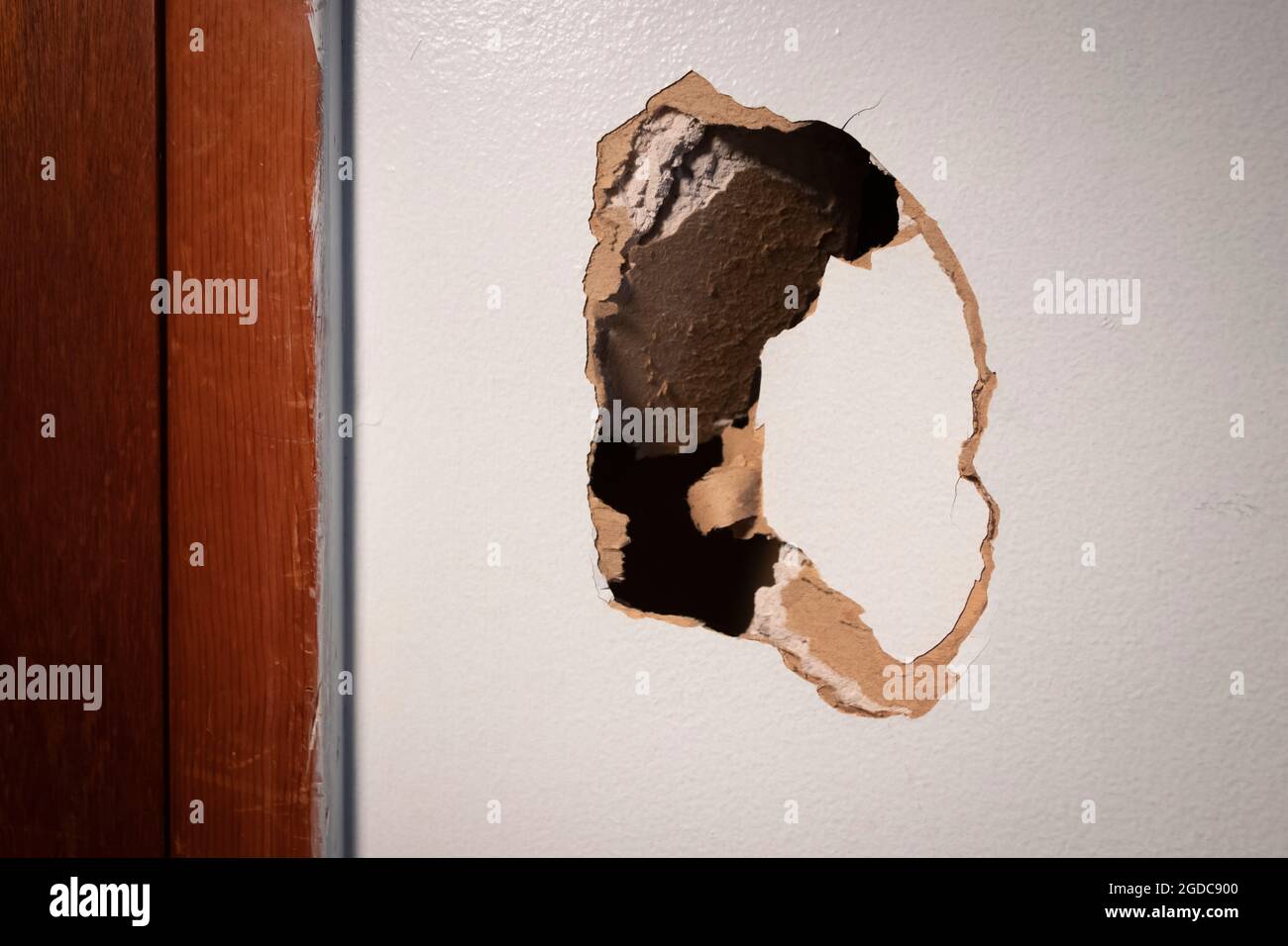 Large hole in damaged drywall, in need of repair Stock Photo - Alamy
