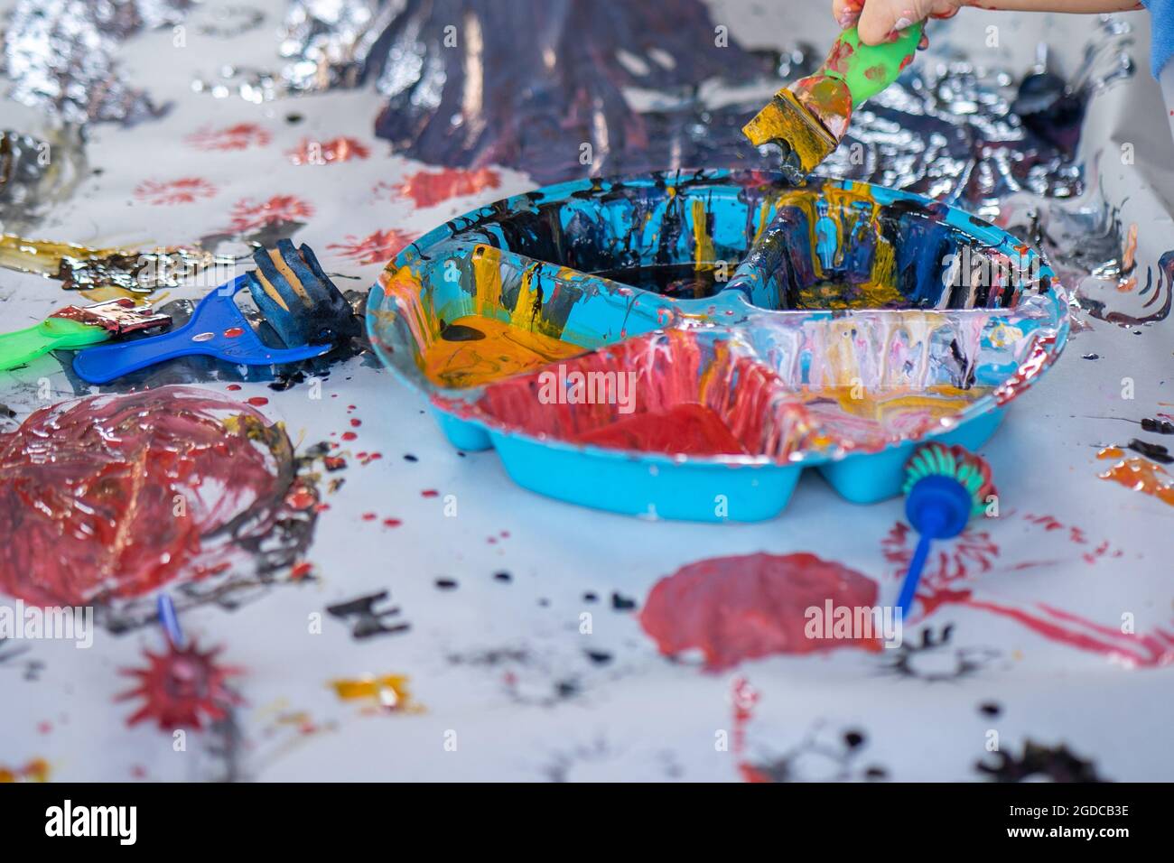Closeup shot of a messy painting table at a preschool Stock Photo - Alamy