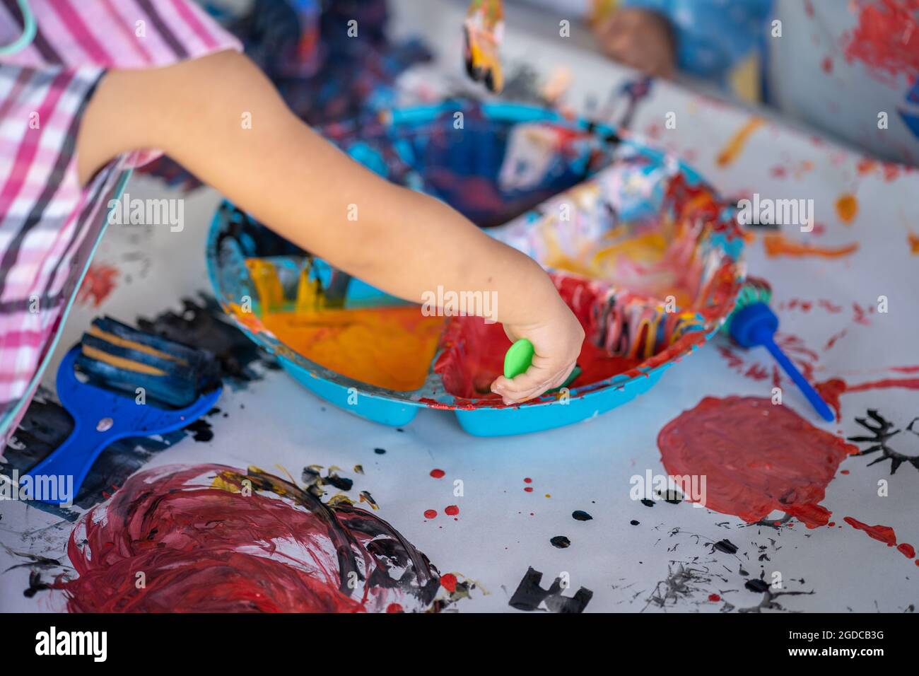 Closeup shot of a messy painting table at a preschool Stock Photo - Alamy