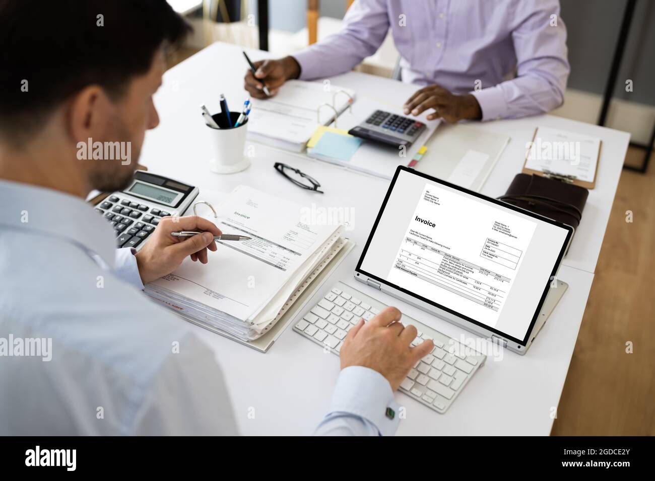 Tax Account Using Calculator For Audit And Compliance Stock Photo - Alamy