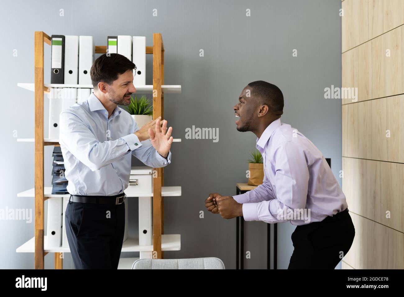 Angry African American Man Shouting To Other In Conflict Stock Photo ...