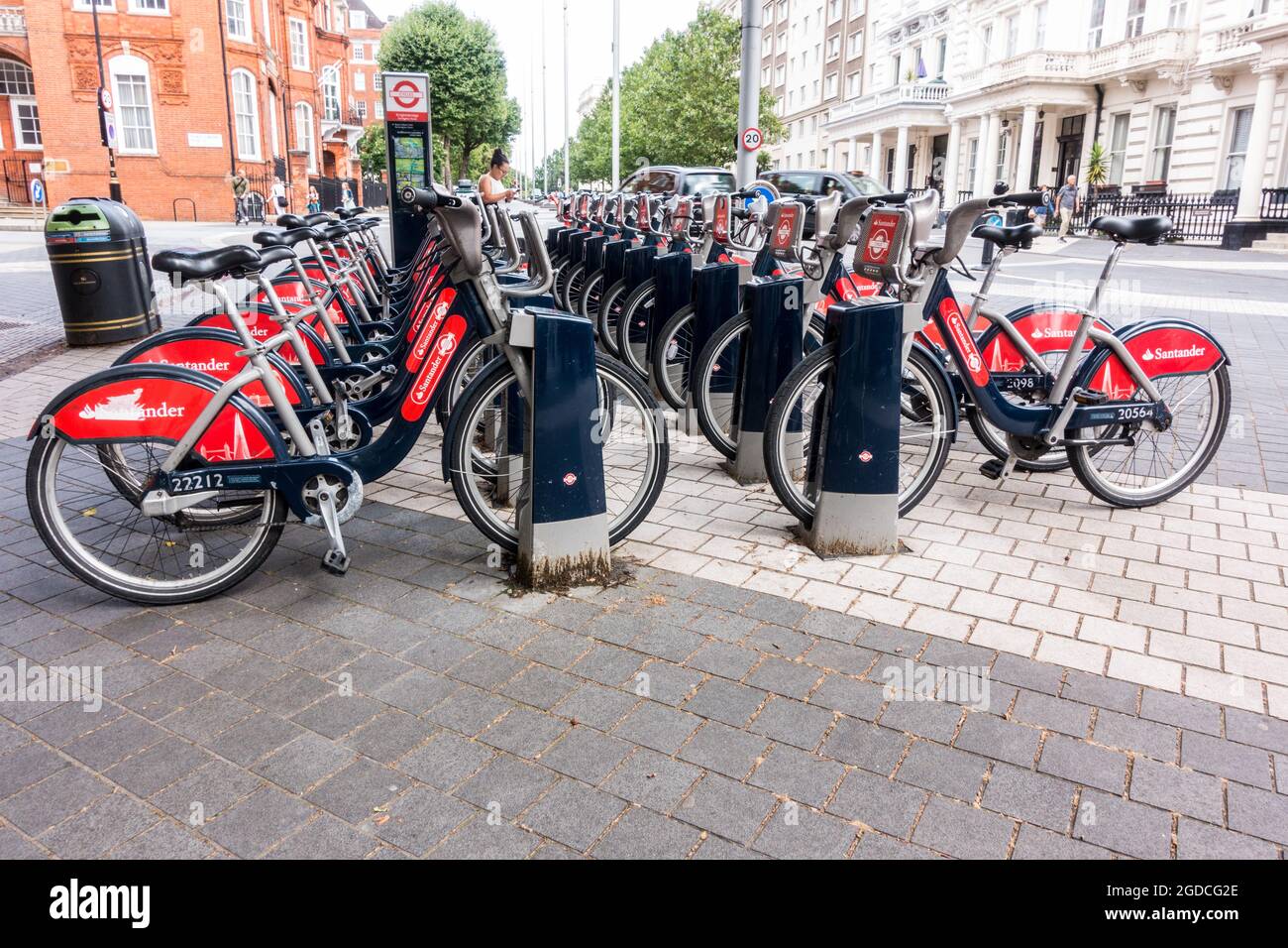Santander bike share in London city docking station Stock Photo - Alamy