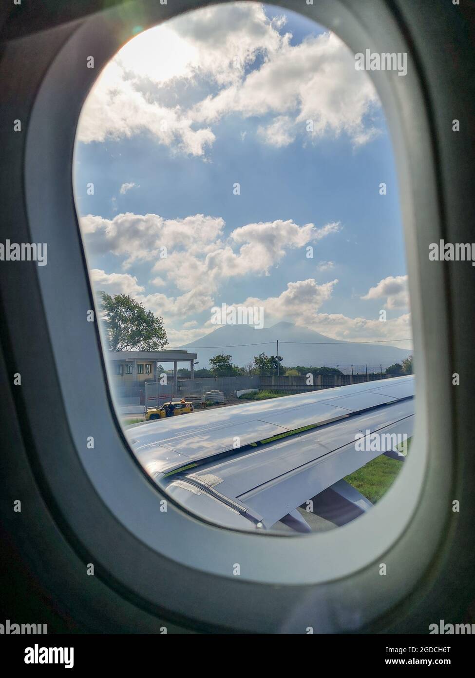 Naples, Italy - August 27 2020: Window view to big airport and square ...