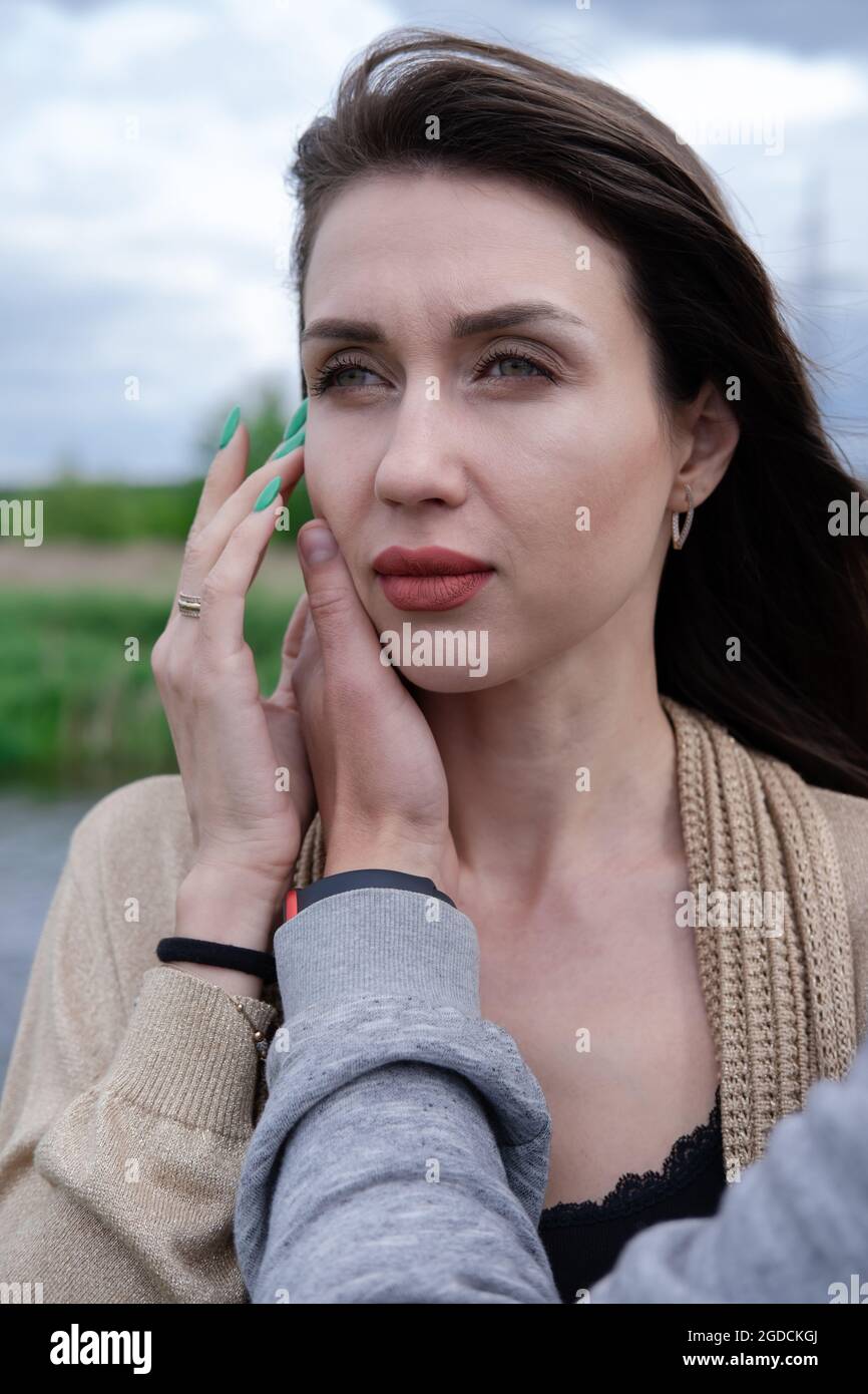 Woman touching mans face hi-res stock photography and images - Alamy