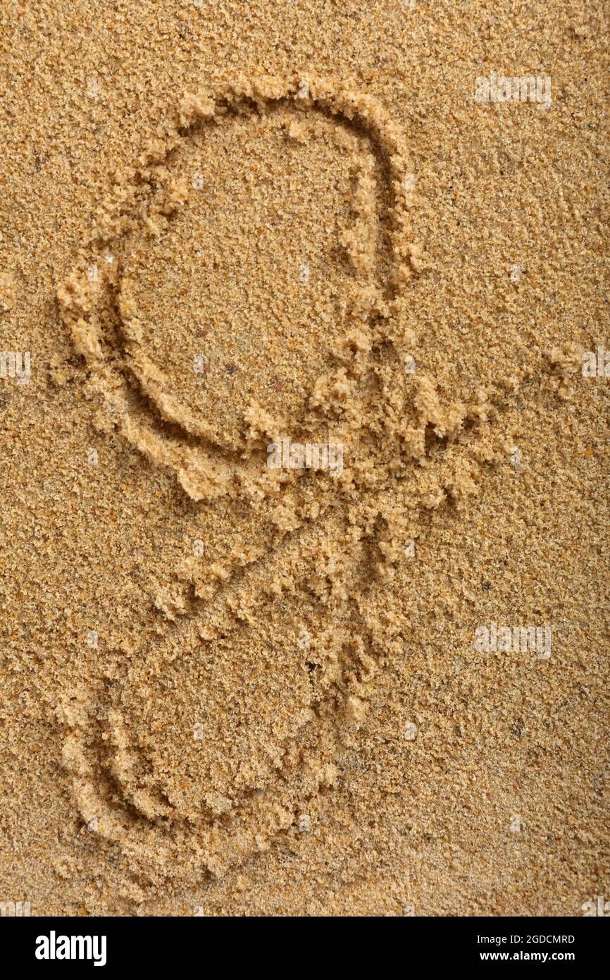 Alphabet letter written on wet beach sand Stock Photo - Alamy