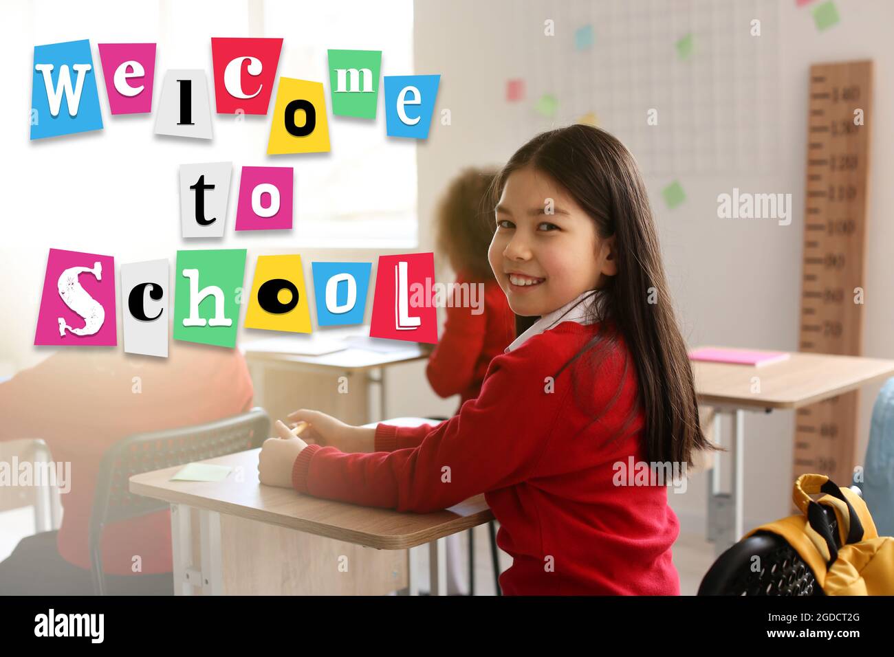 Cute little school girl during lesson at school Stock Photo - Alamy