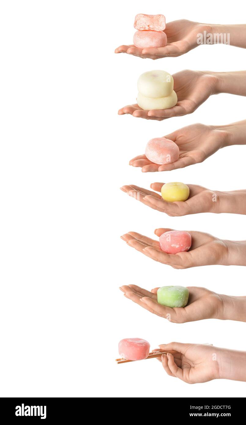 Female hands with tasty Japanese mochi on white background Stock Photo ...