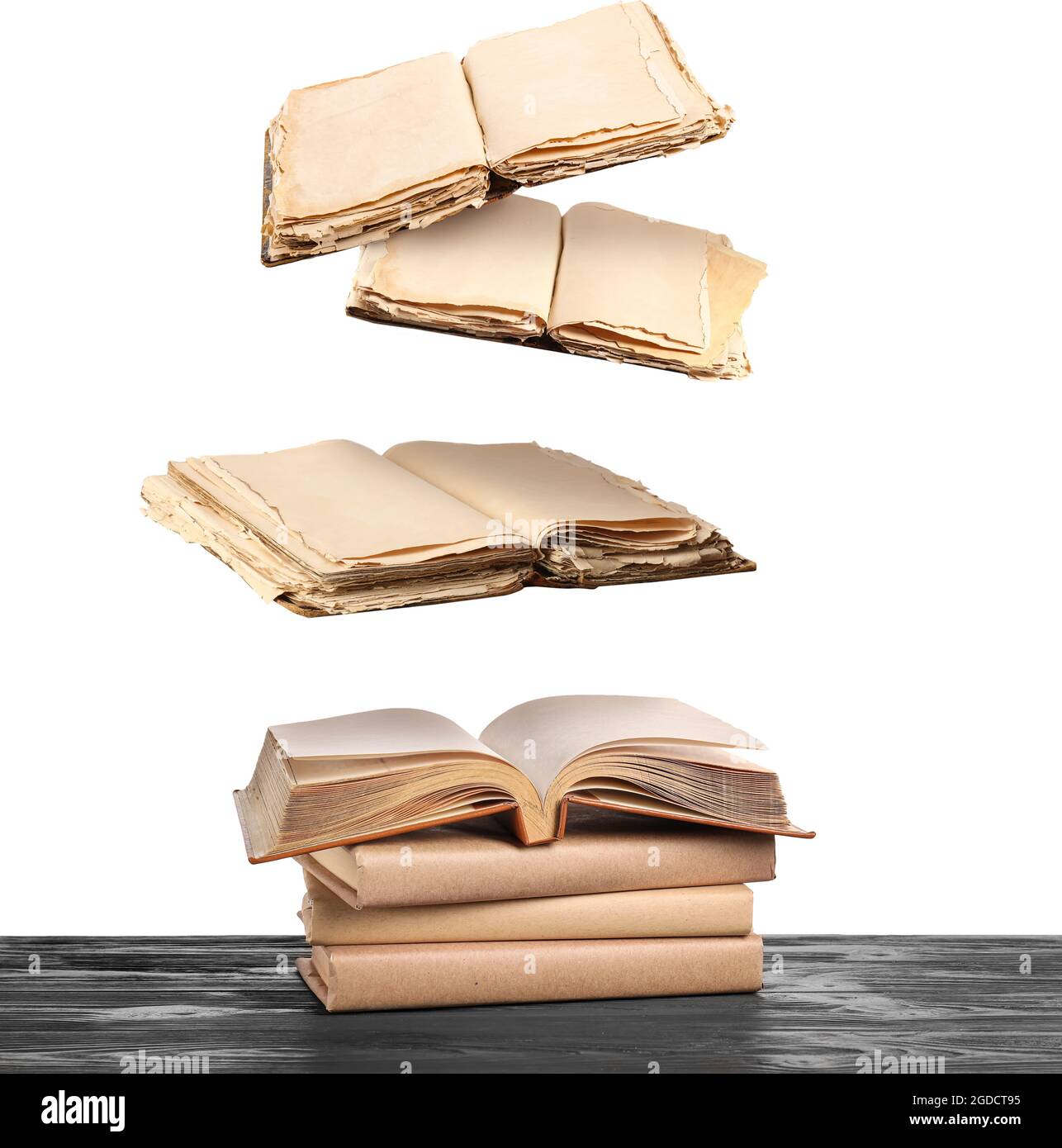 Flying old books on white background Stock Photo - Alamy