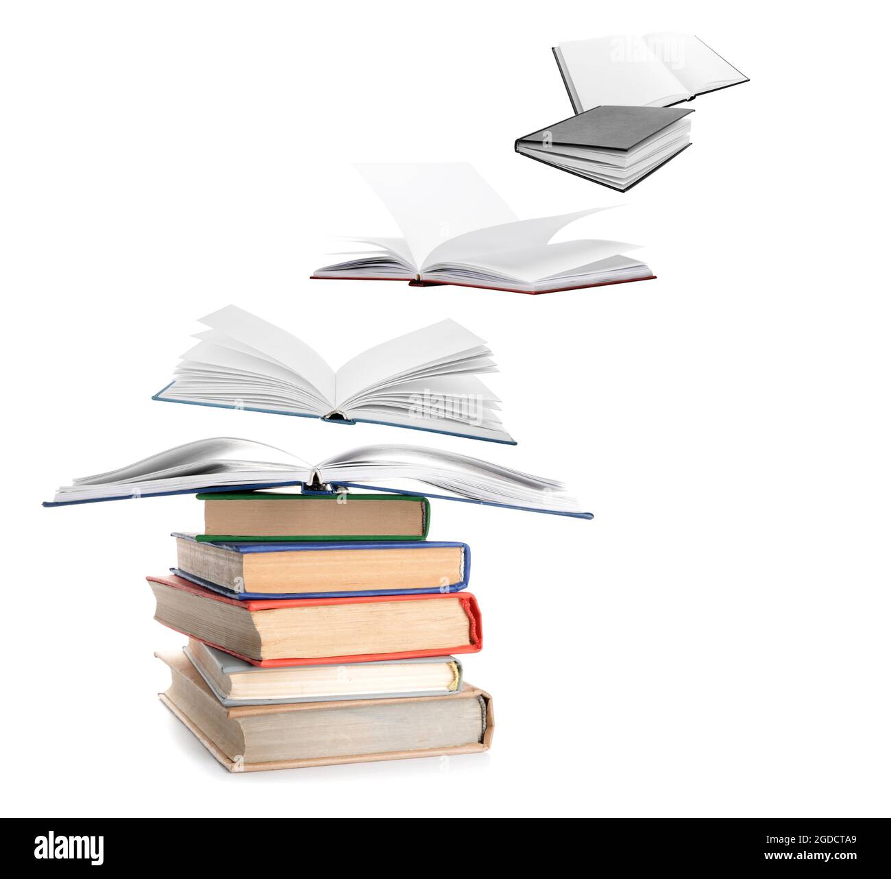 Flying books on white background Stock Photo - Alamy