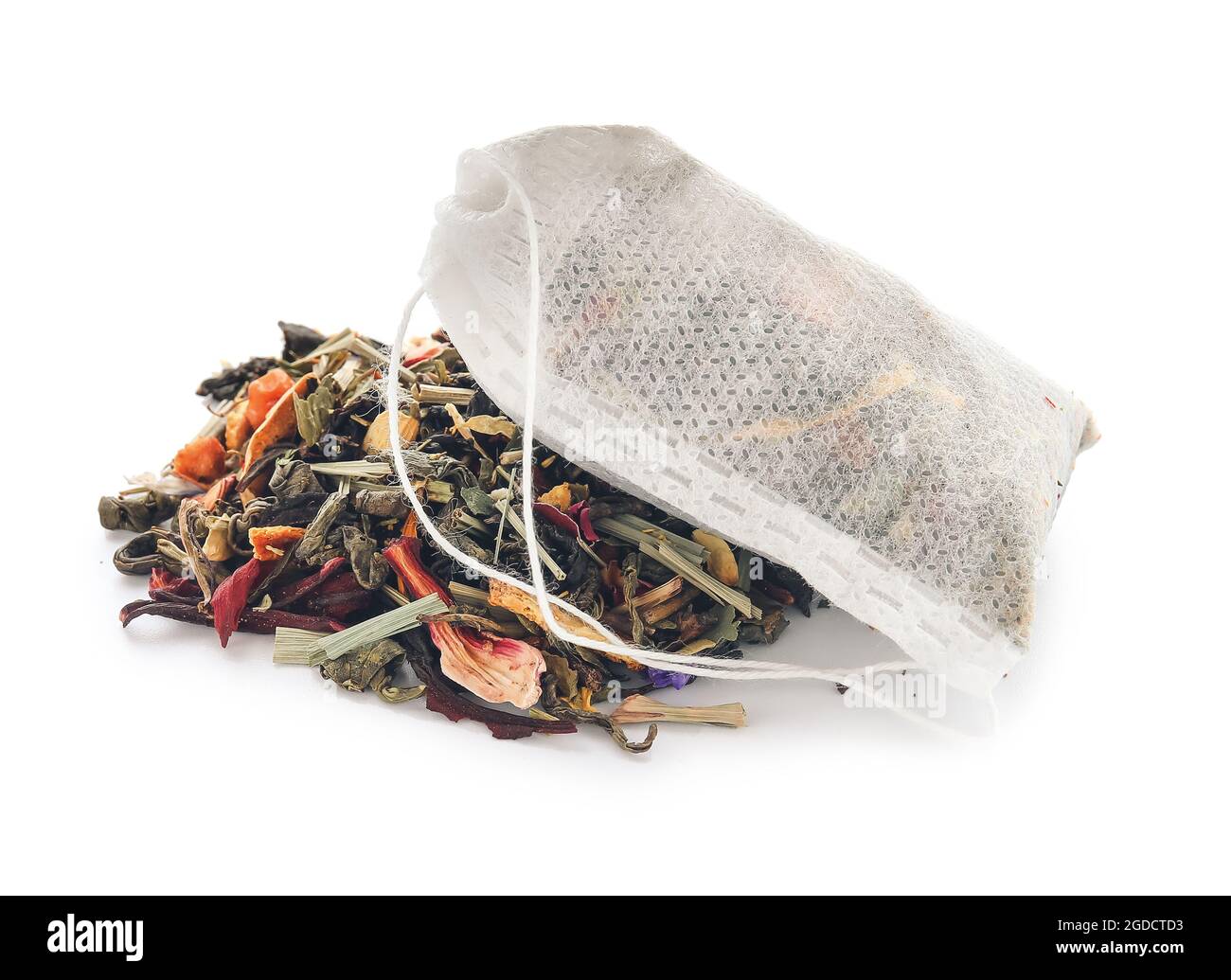Tea bag with dry leaves on white background Stock Photo - Alamy