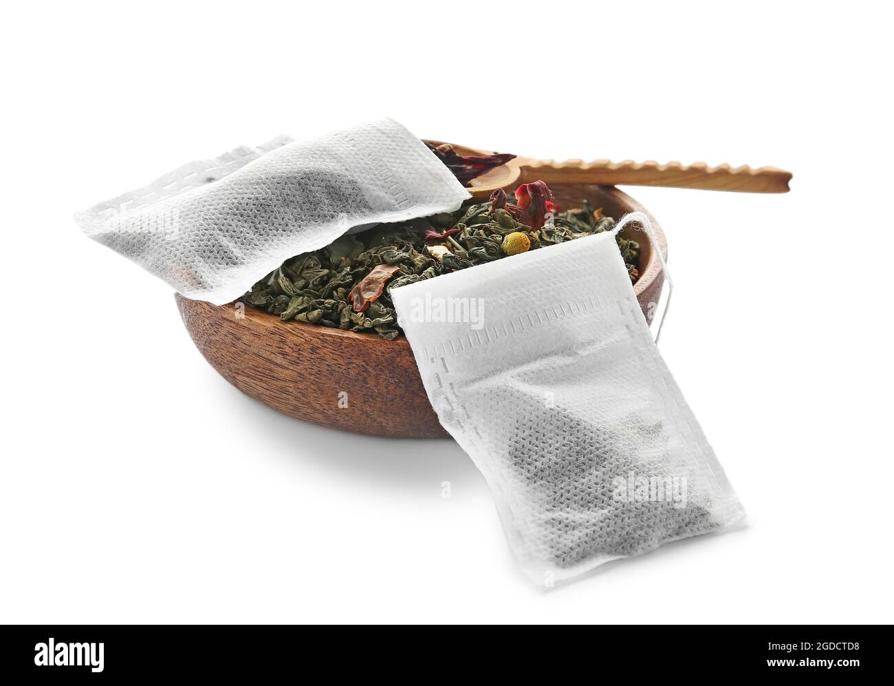 Tea bags and bowl with dry leaves on white background Stock Photo - Alamy