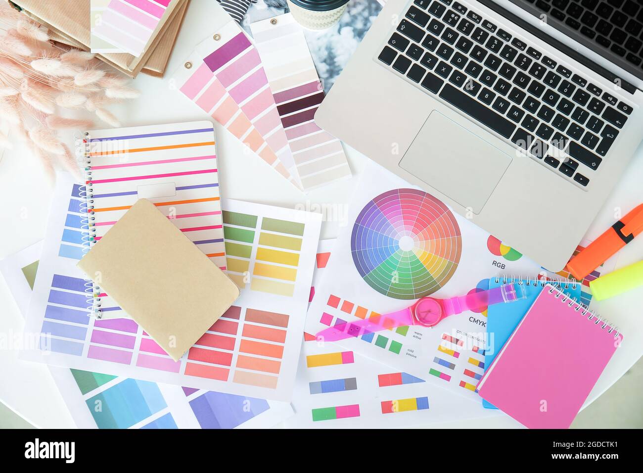 Modern laptop and color palettes on table of graphic designer in office ...