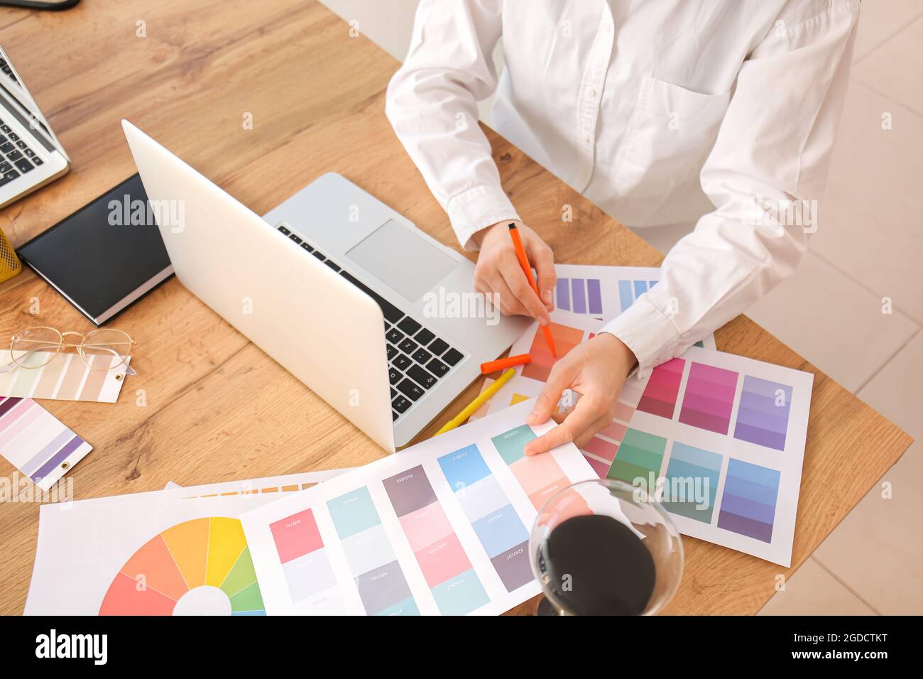 Graphic designer working in office Stock Photo - Alamy