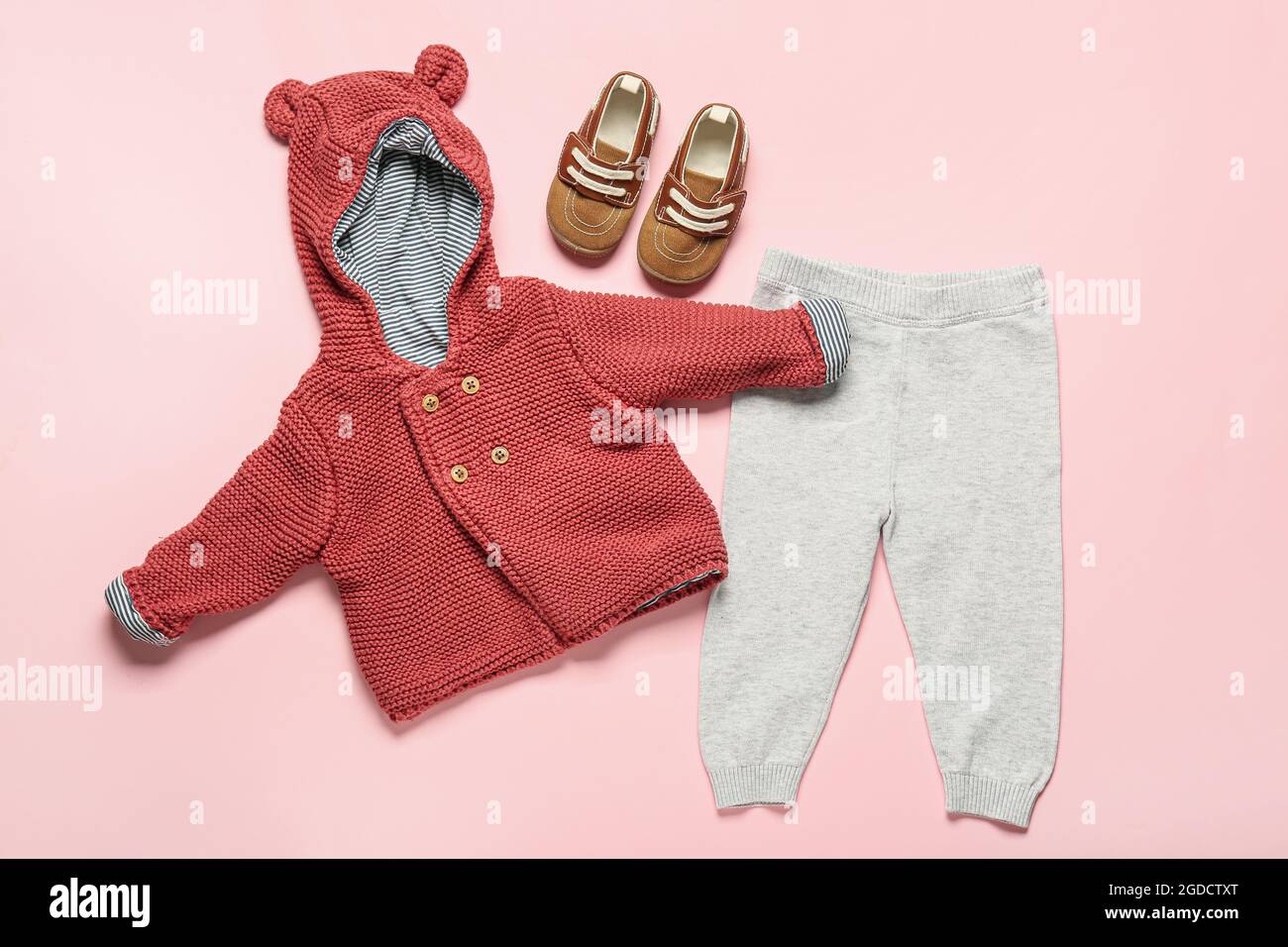 Stylish baby clothes on color background Stock Photo - Alamy