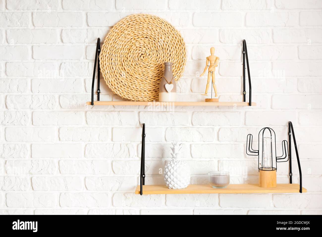 Hanging shelves on brick wall hi-res stock photography and images - Alamy