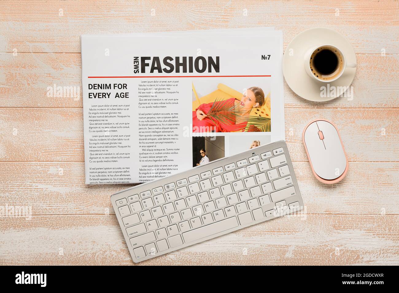 Composition with newspaper and computer keyboard on light wooden ...