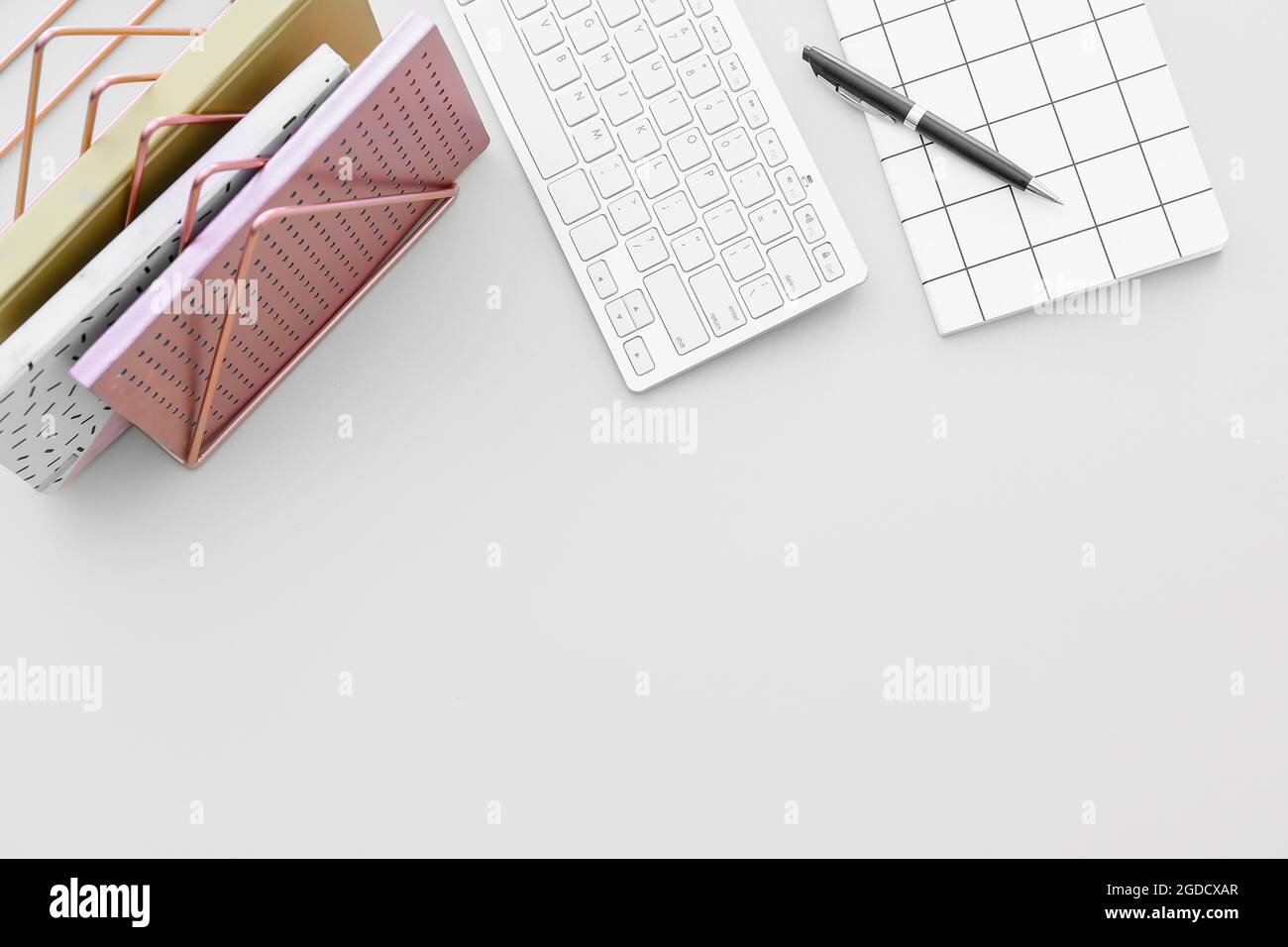 Notebooks with pen and computer keyboard on light background Stock ...