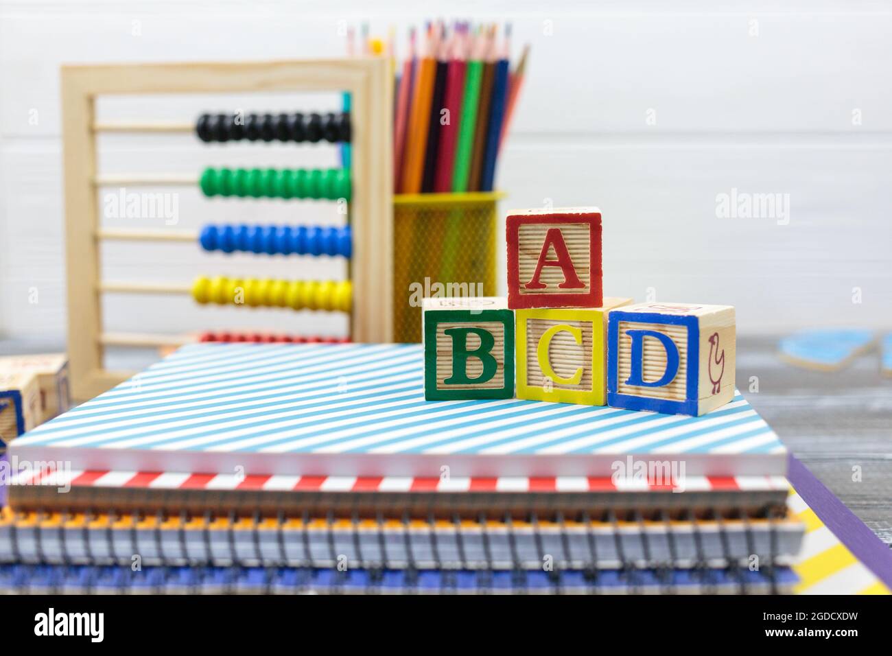 Wooden alphabet blocks on a white wooden background. Back to school ...