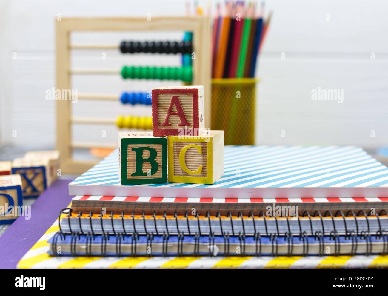 Wooden alphabet blocks on a white wooden background. Back to school ...