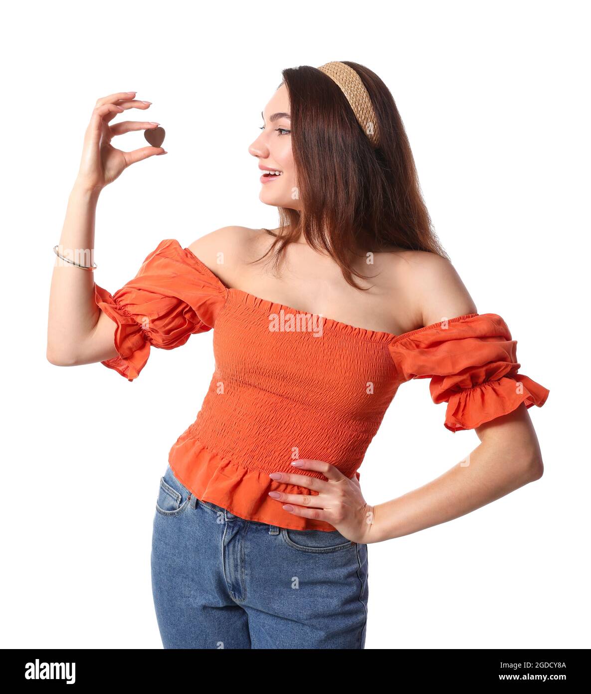 Beautiful young woman with chocolate candy on white background Stock ...