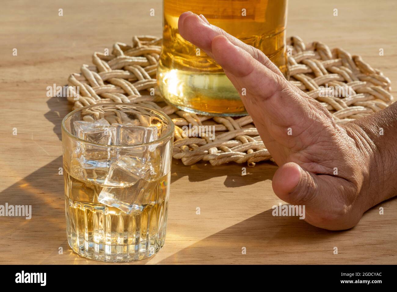 Hands lock chain a glass of whiskey to stop drinking. Alcoholism ...