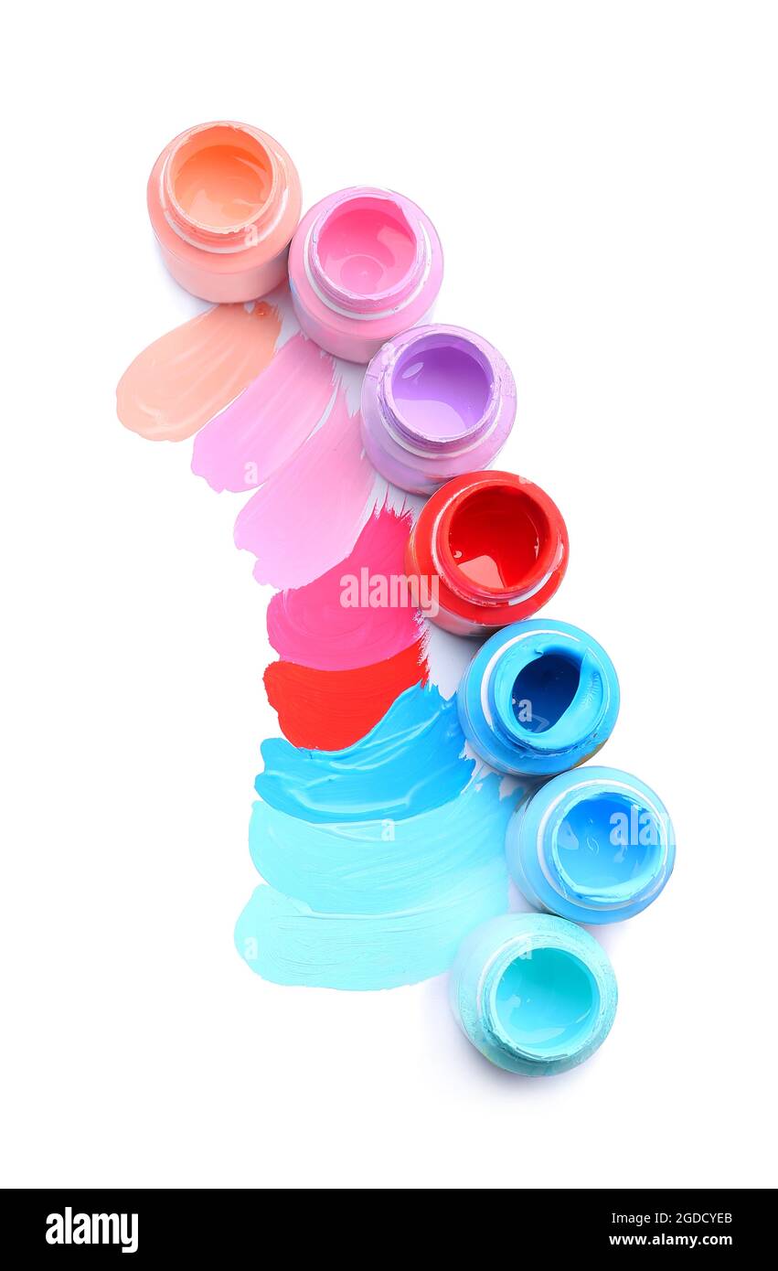 Paint bottles with samples on white background Stock Photo - Alamy