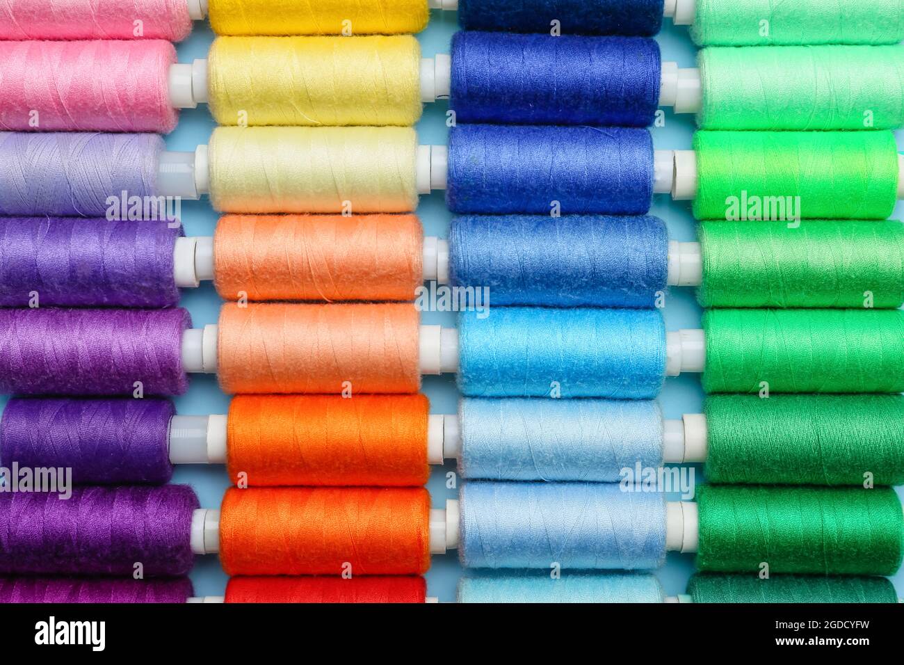 Many threads on color background Stock Photo - Alamy