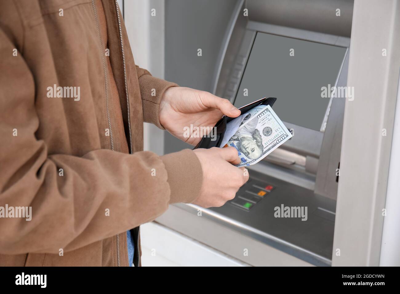 Man withdrawing money from ATM Stock Photo - Alamy