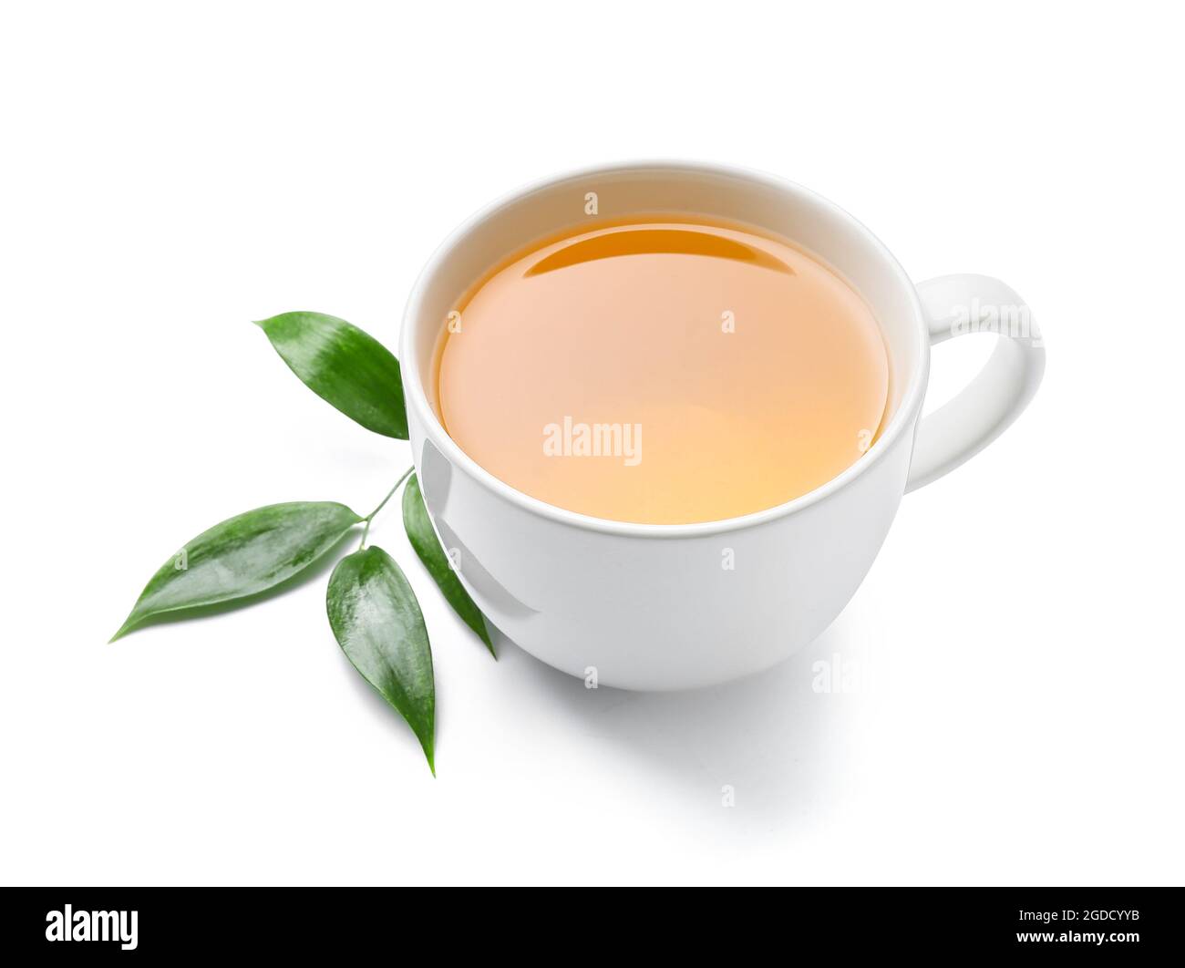 Cup of tea and green leaves on white background Stock Photo - Alamy