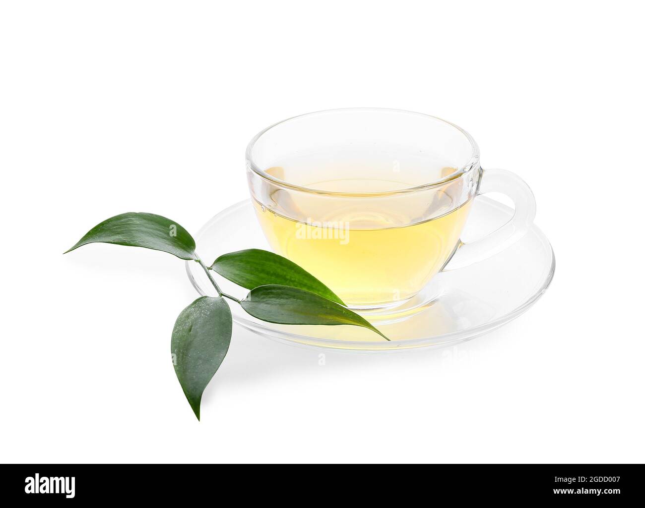 Glass cup of tea and green leaves on white background Stock Photo - Alamy