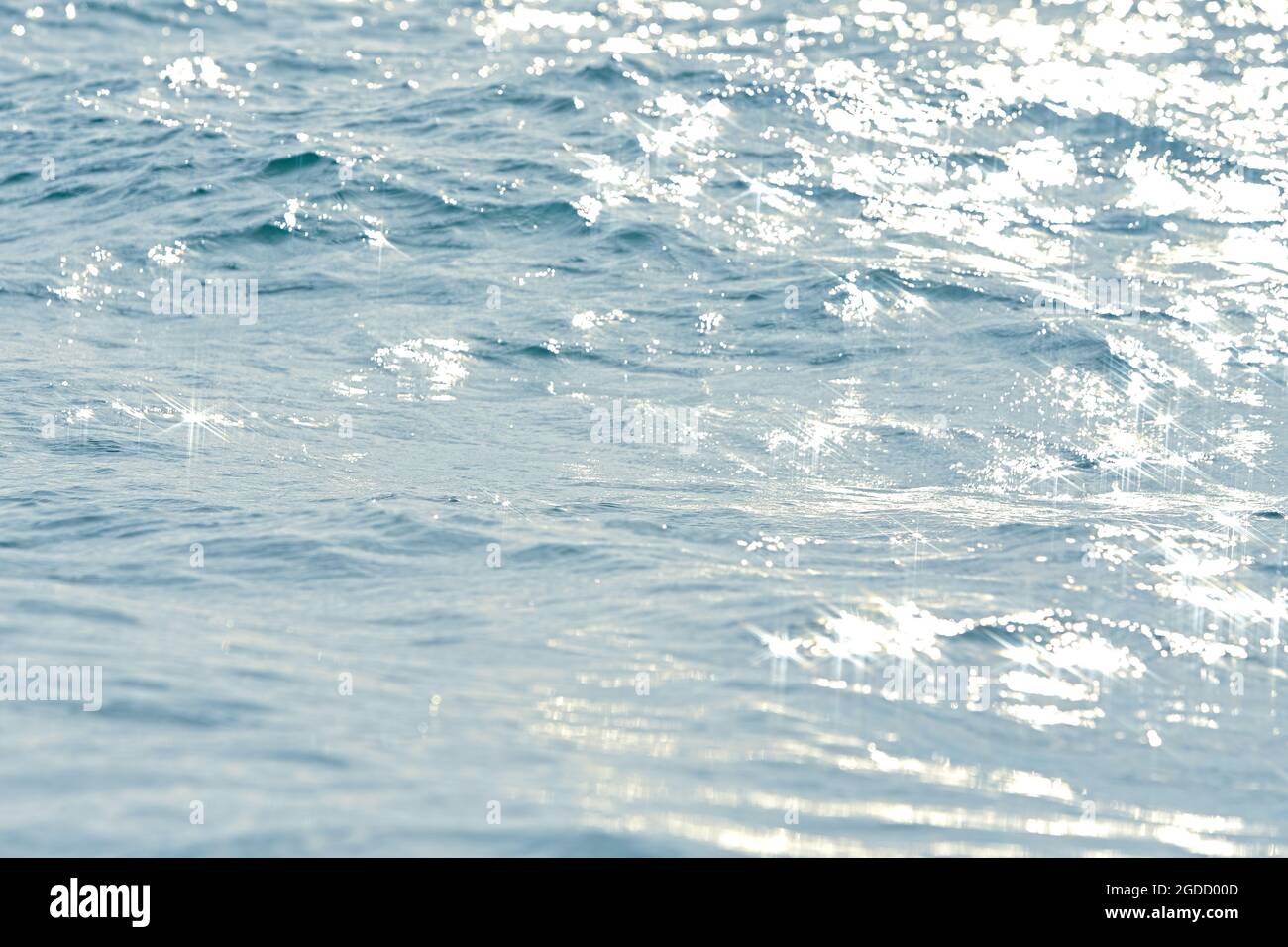 Detail of a sunlight reflecting in glittering sea. sparkler in water ...
