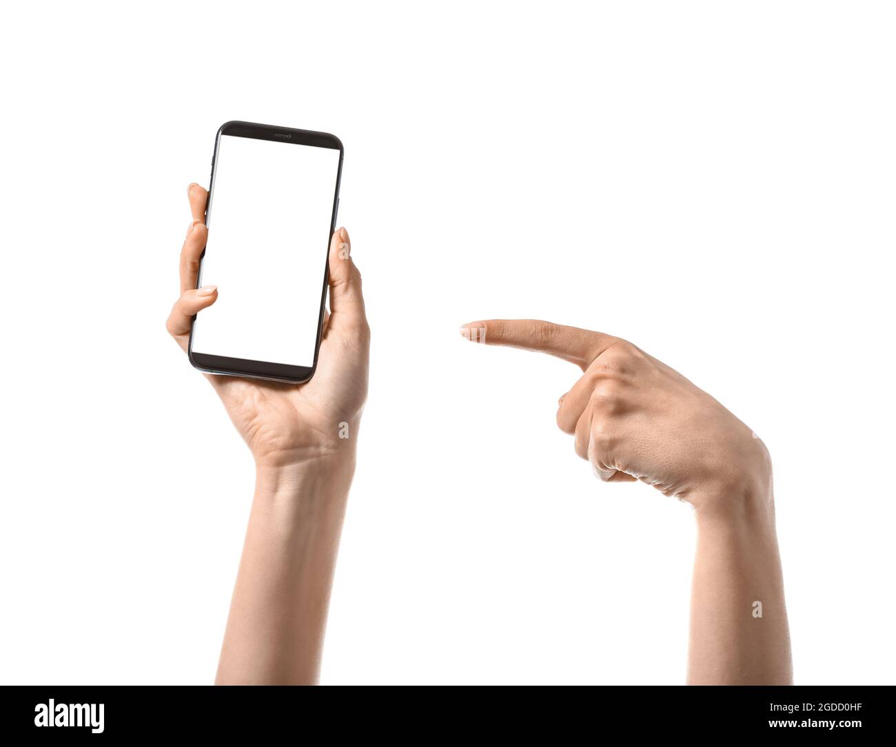 Woman pointing at mobile phone on white background Stock Photo - Alamy