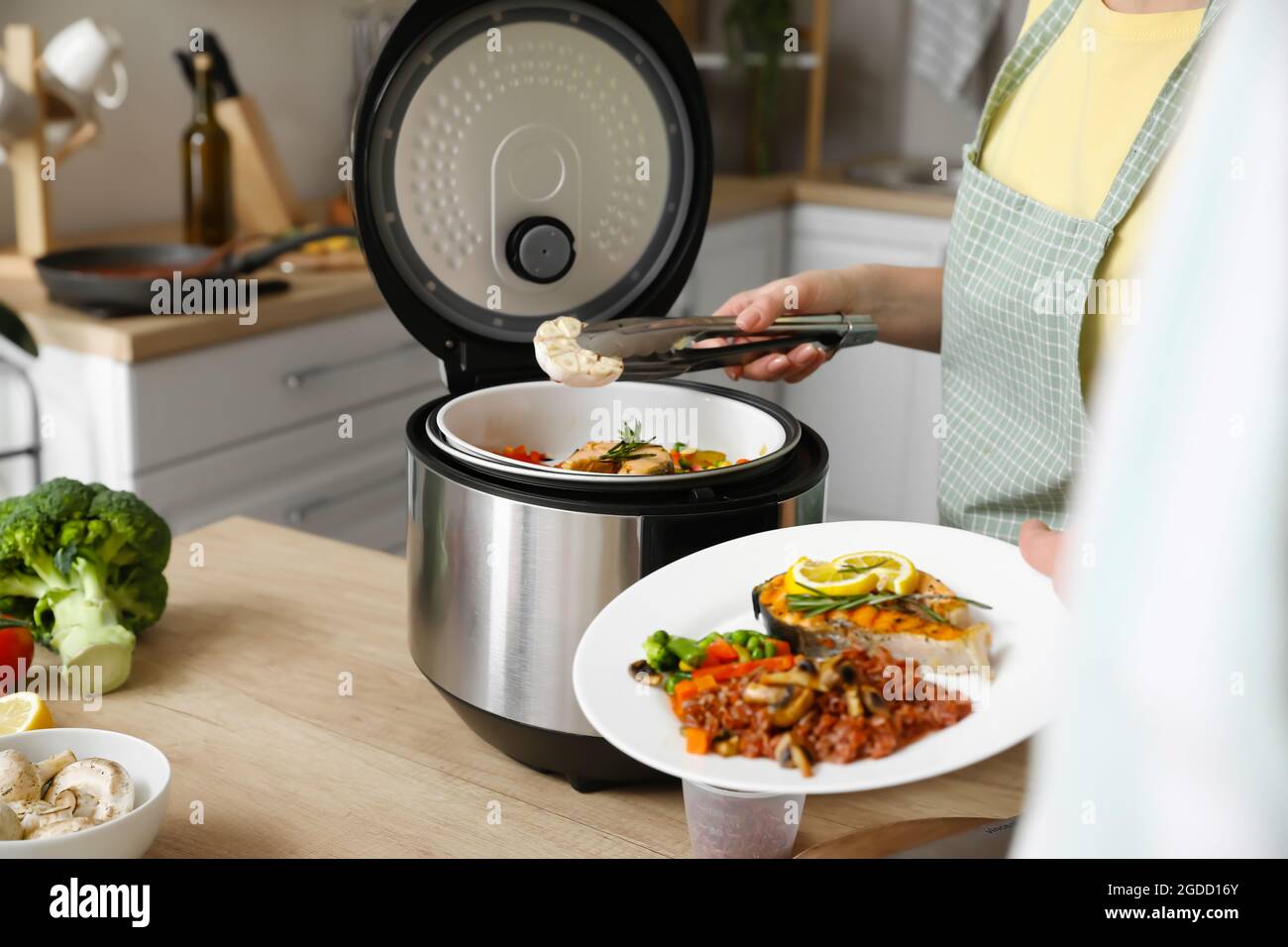 Young couple cooking in kitchen Stock Photo - Alamy
