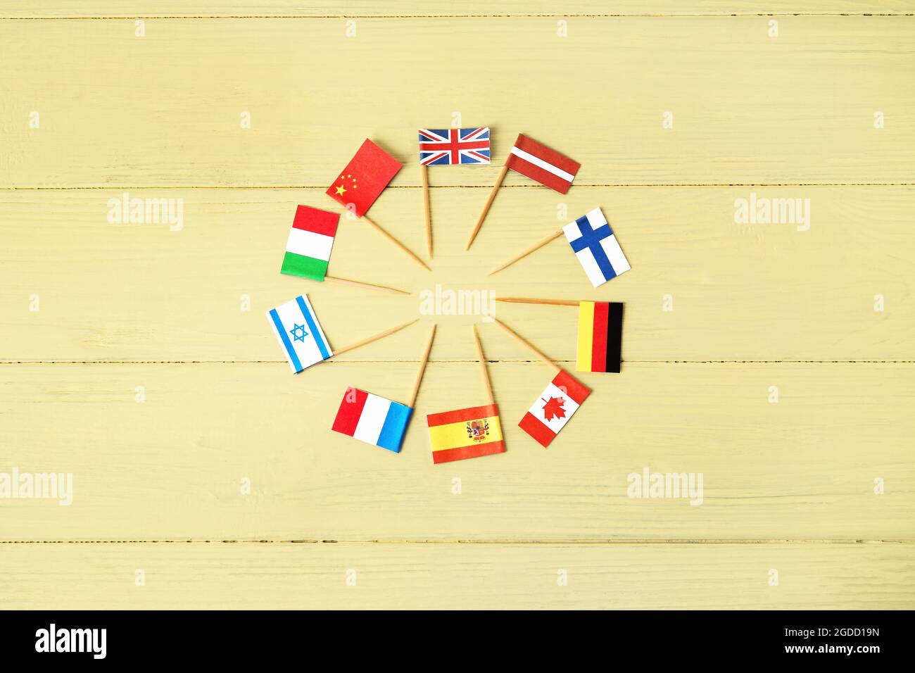 Flags of different countries on color wooden background Stock Photo - Alamy