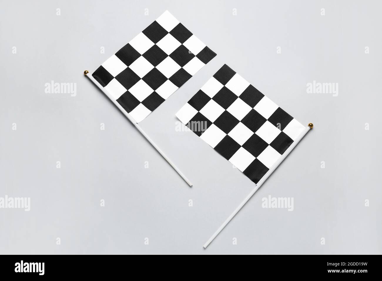 Racing flags on grey background Stock Photo - Alamy