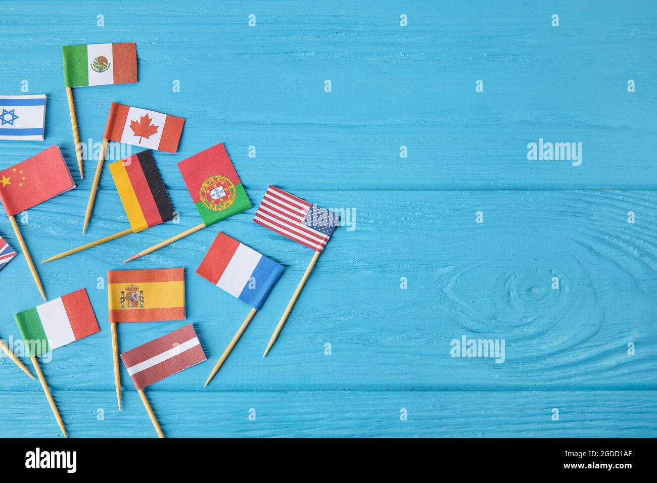 Flags of different countries on color wooden background Stock Photo - Alamy
