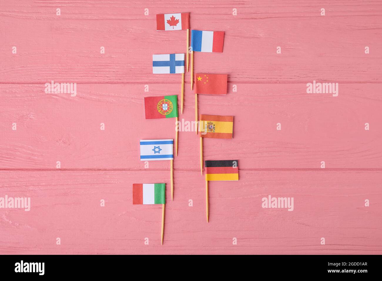 Flags of different countries on color wooden background Stock Photo - Alamy