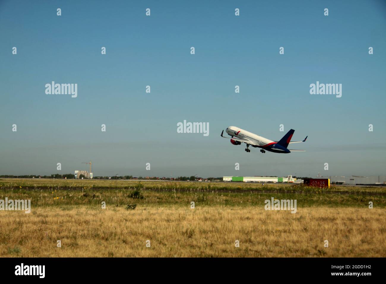 Passenger plane takes off from the airport runway. Side-view of aircraft. Horizontal image Stock ...