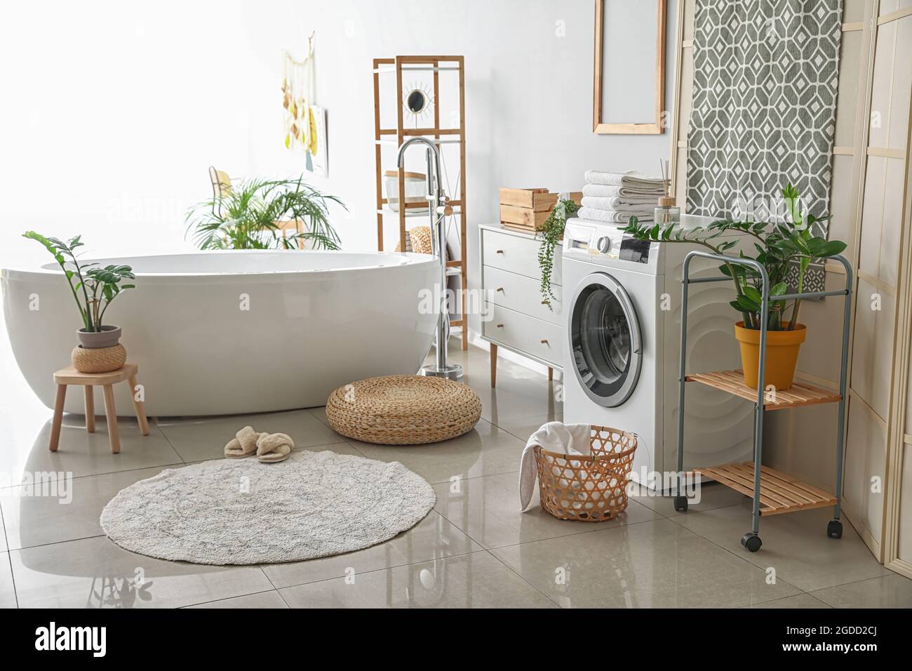 Interior of bathroom with modern washing machine Stock Photo - Alamy