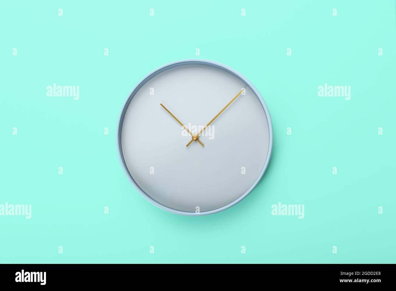 Stylish clock on color background Stock Photo - Alamy