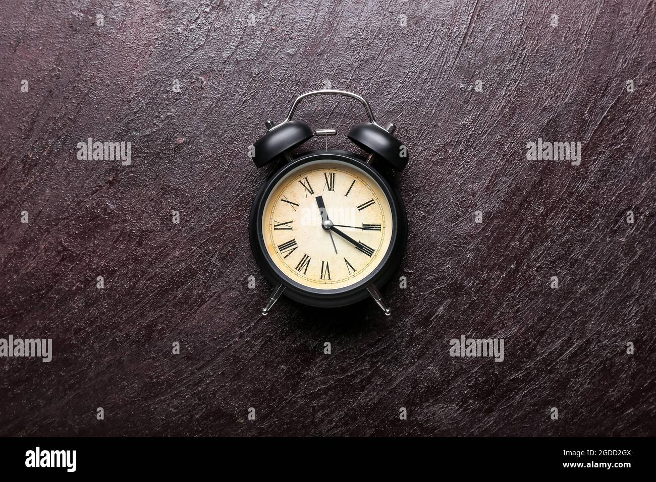 Stylish alarm clock on dark background Stock Photo - Alamy