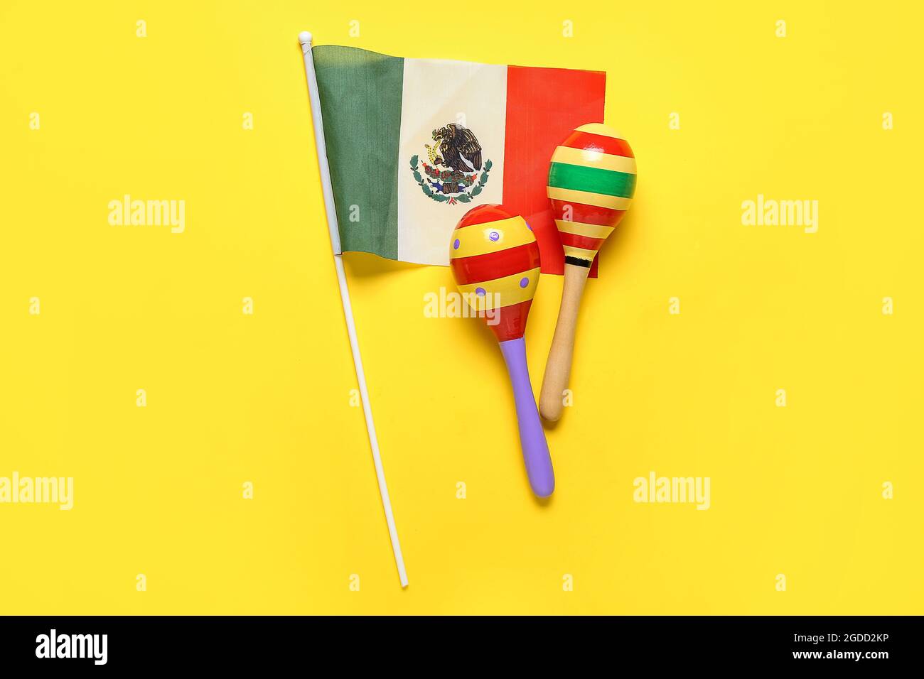 Mexican flag and maracas on color background Stock Photo - Alamy