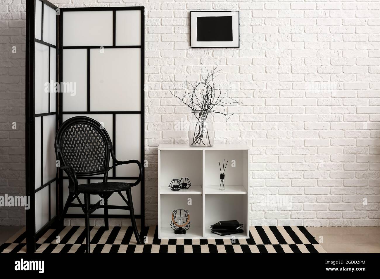 Interior of stylish living room with chest of drawers Stock Photo - Alamy